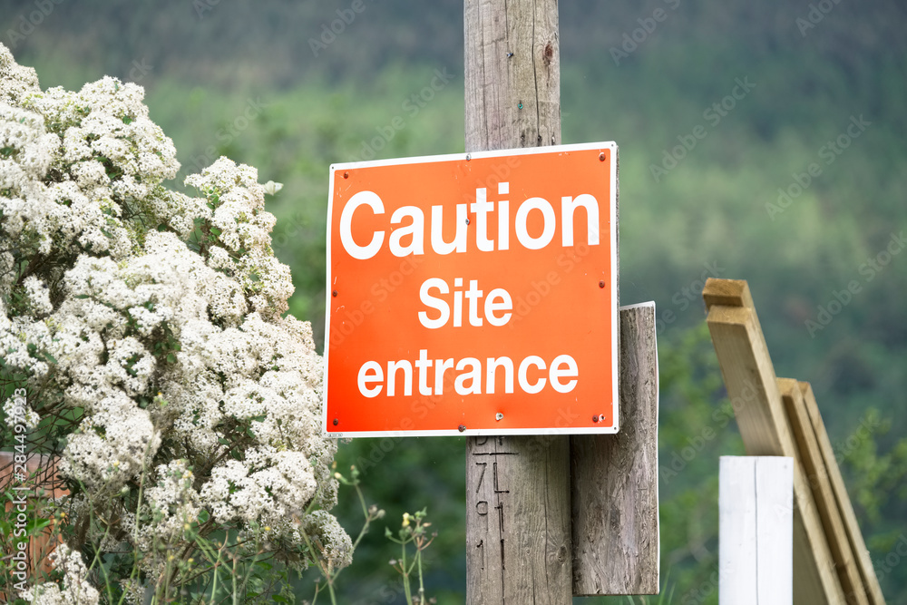 Site entrance caution sign at construction of building Stock Photo ...