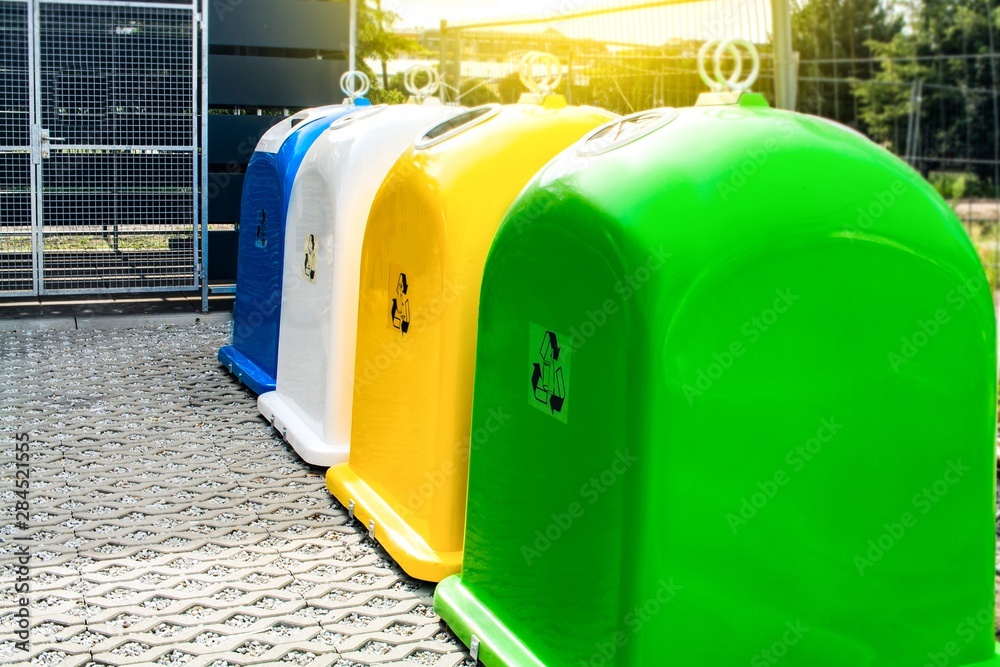 Colored plastic trash cans . Large wheelie bins . Urban recycling waste ...