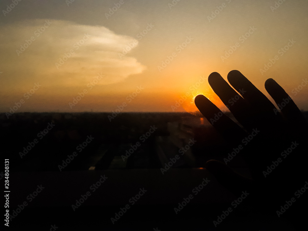Beautiful sunset, silhouette touch the sun, image of finger catch the ...
