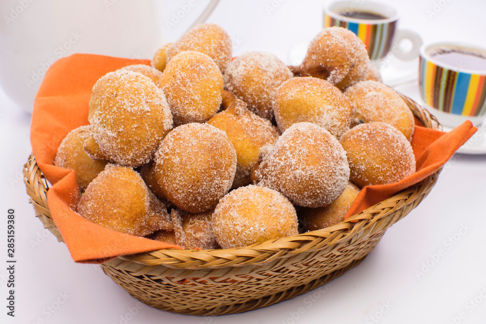 Traditional Brazilian mini fried cakes called bolinho de chuva in a ...