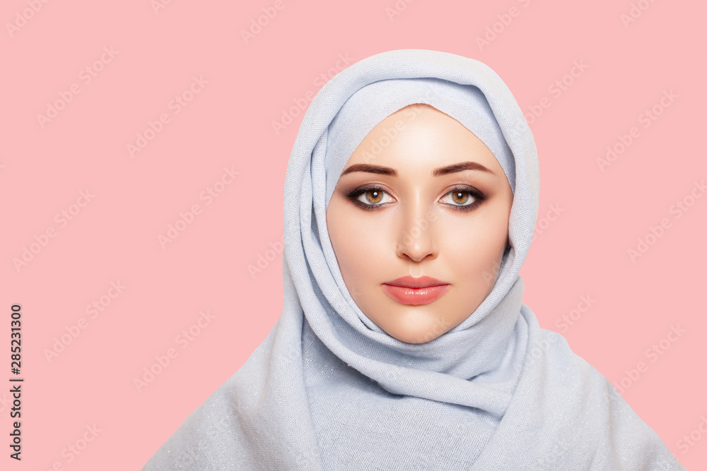 Beautiful young Middle eastern Woman wearing Abaya. pink lips. Vertical ...