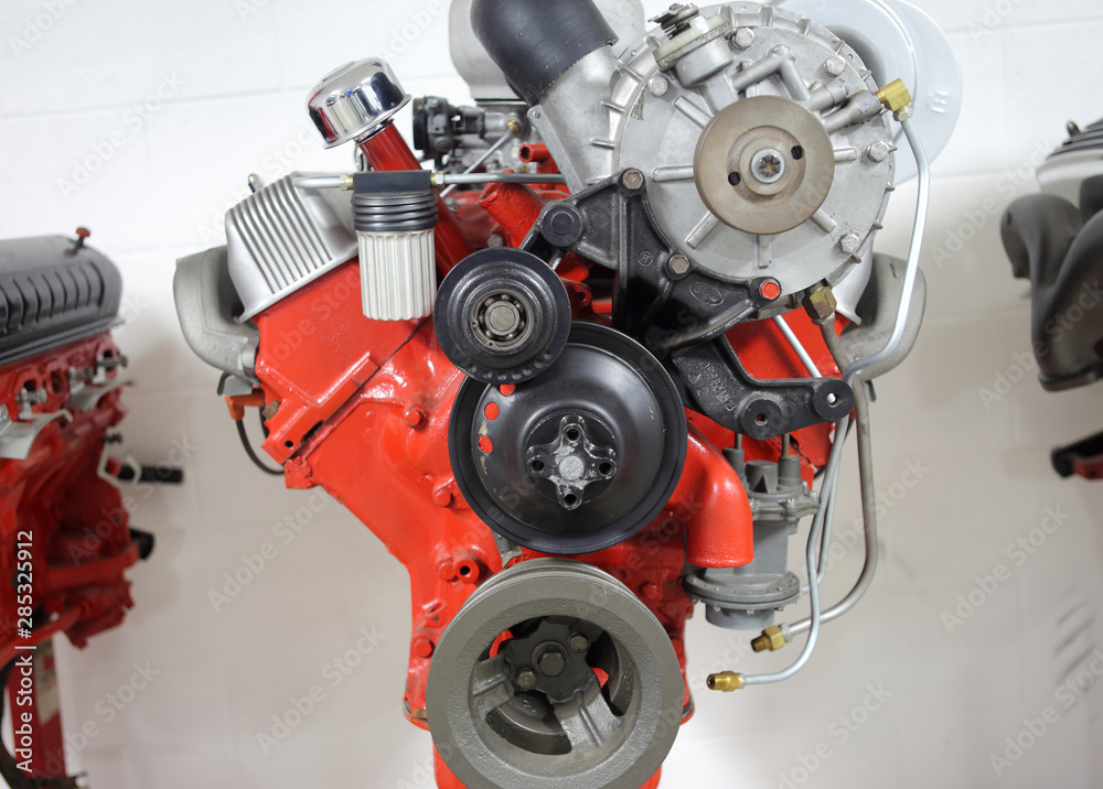 An American V8 combustion engine on display at an automotive shop ...
