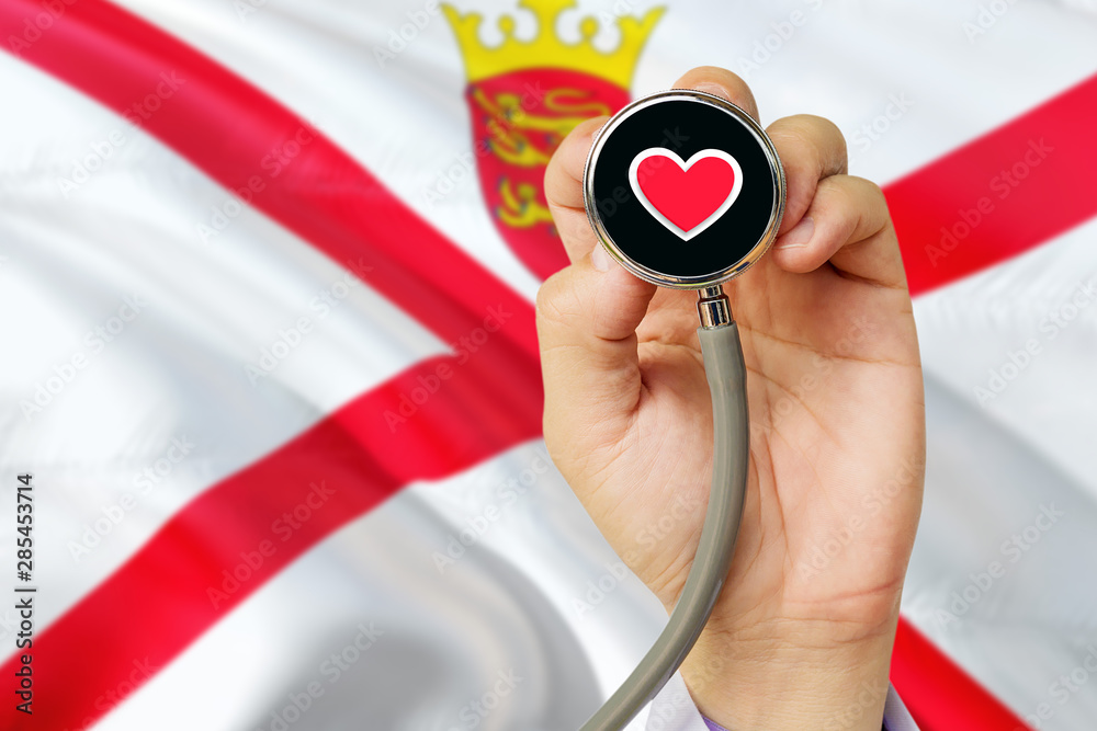 Doctor holding stethoscope with red love heart. National Jersey flag ...