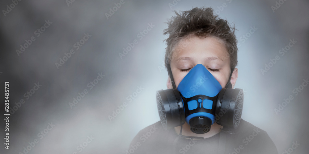 Young boy wearing gasmask, respirator portrait. Effects of worldwide ...