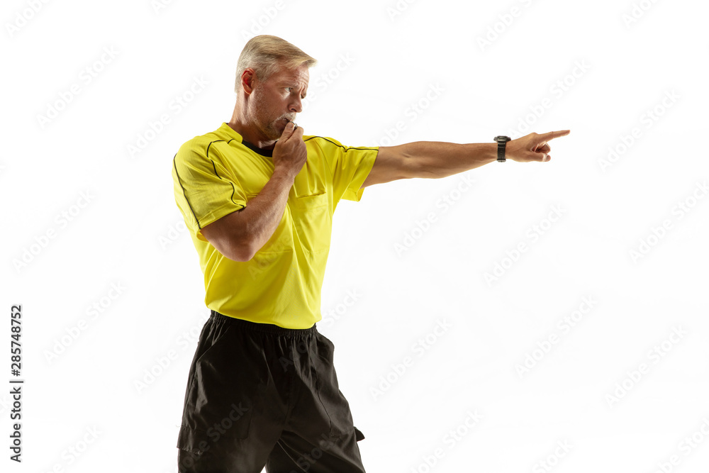 Referee gives directions with gestures to football or soccer players ...