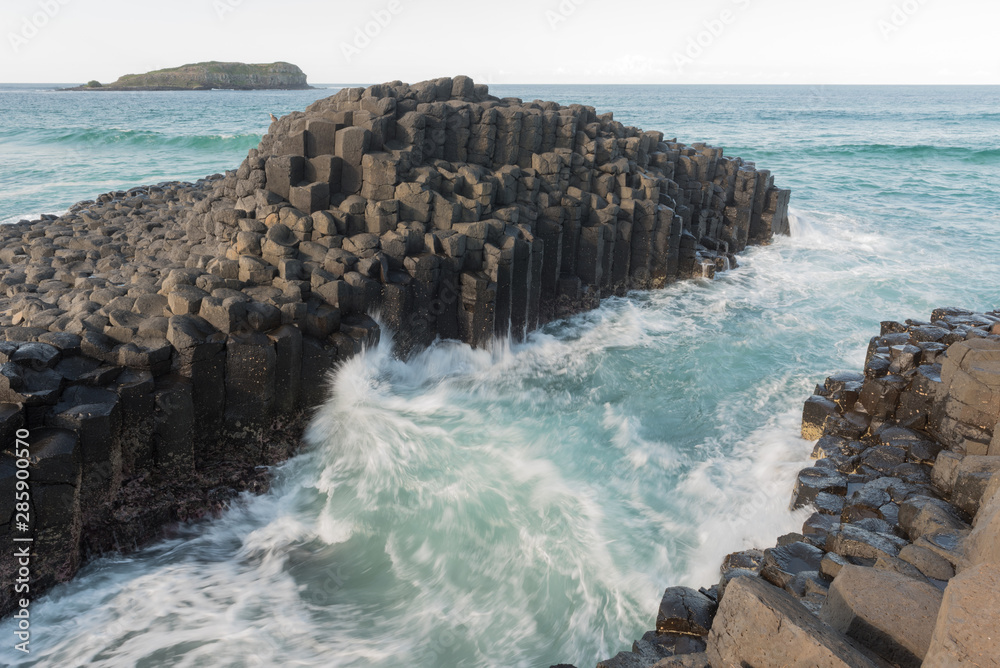 Black, basalt columns on a small island just off the tip of Fingal Head ...