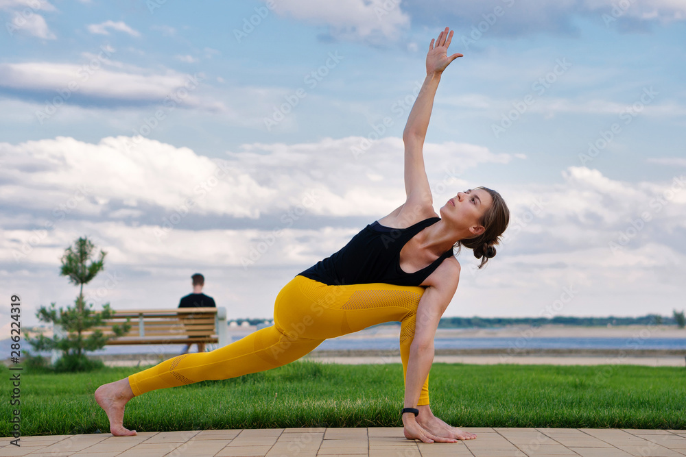 Stock-Foto „Yoga time. Woman yoga instructor. Handsome athletic woman ...