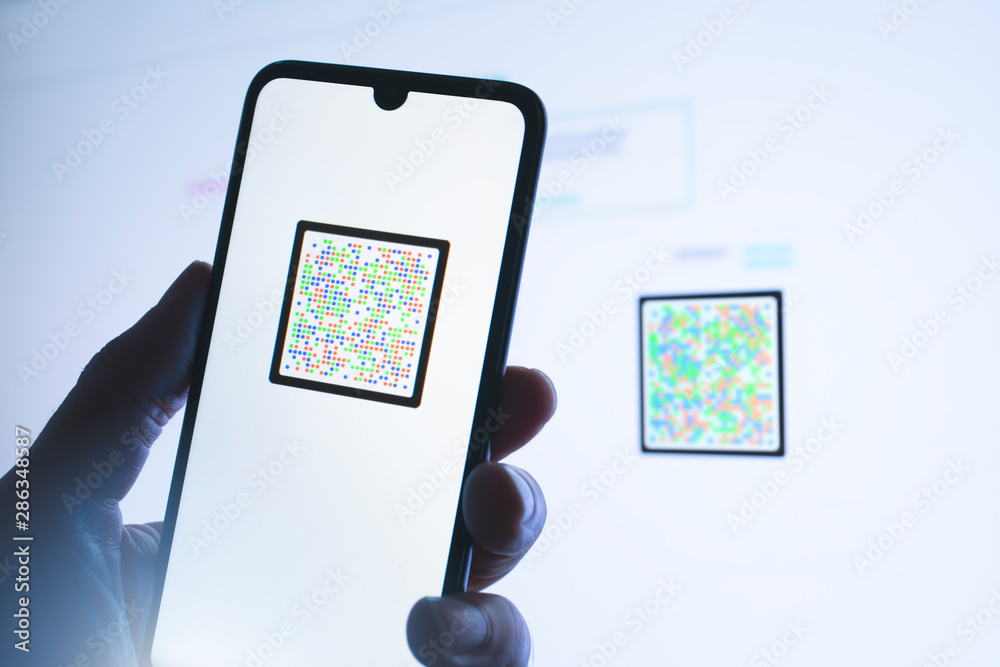 Online banking using PhotoTAN. A mobile app is used to photograph a ...