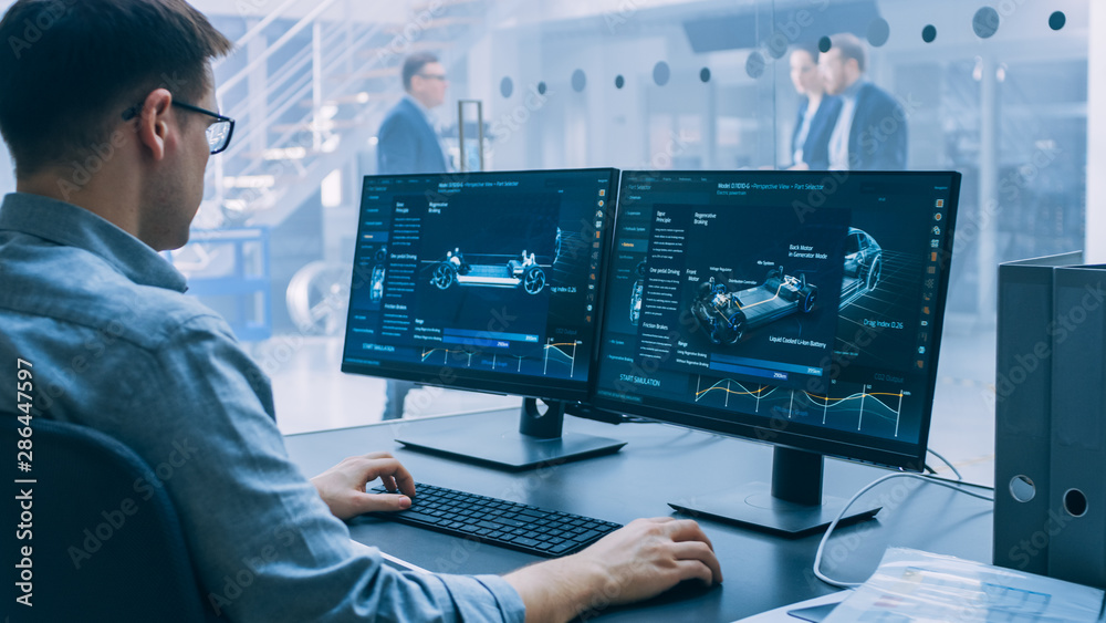 Professional Engineer Works on a Computer with a 3D CAD Software and ...