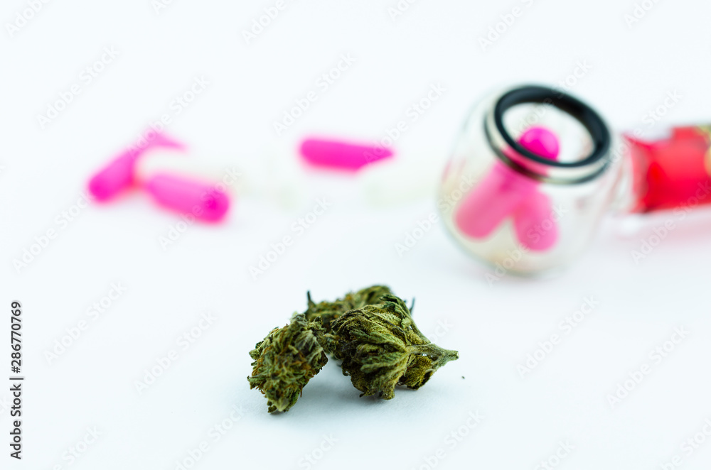 Medical THC marijuana and glass Smoking pipe. There's a pill in the ...