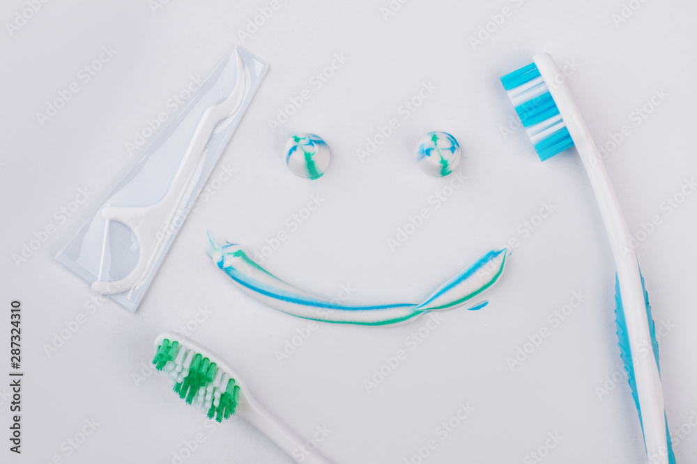 Smiling emoji face painting with toothpaste. Smile from toothpaste and ...
