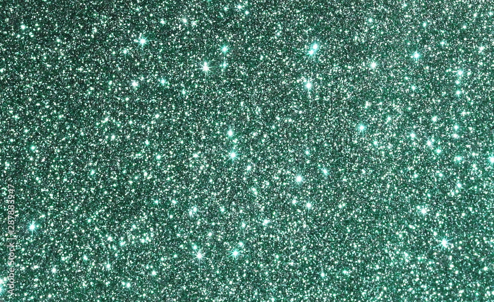 Abstract sparkles background green color. Festive glitter background ...