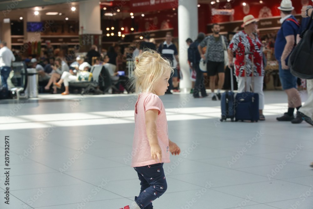 Child lost at the airport or shopping mall, little girl looking for her ...