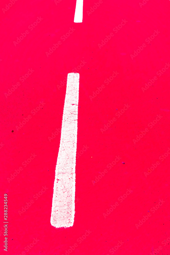 White dashed line on vibrant red background, painted with luminescent ...