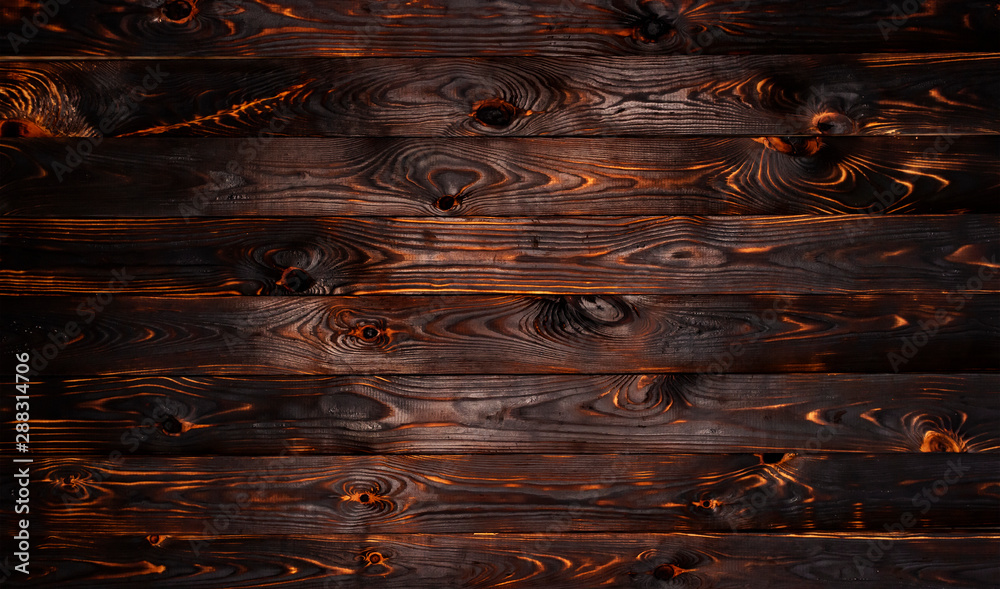 Burnt wooden board, black charcoal wood texture, burned barbecue ...