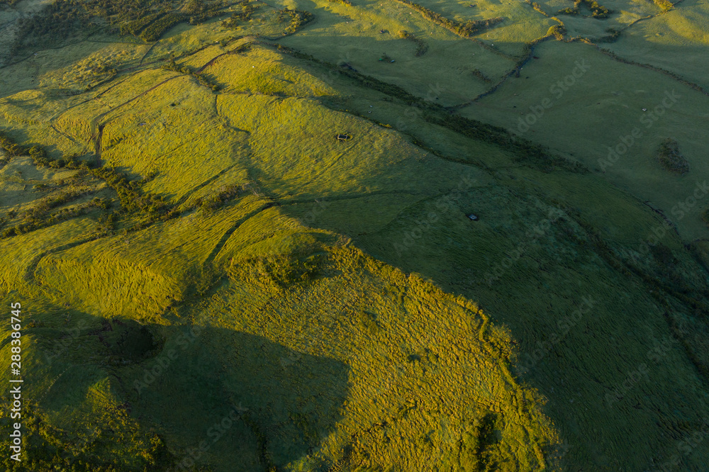 Aerial image of typical green volcanic caldera crater landscape with ...