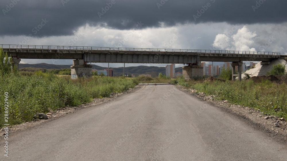 Bypass asphalt road and railway bridge. Town outskirts. Ust-Kamenogorsk ...