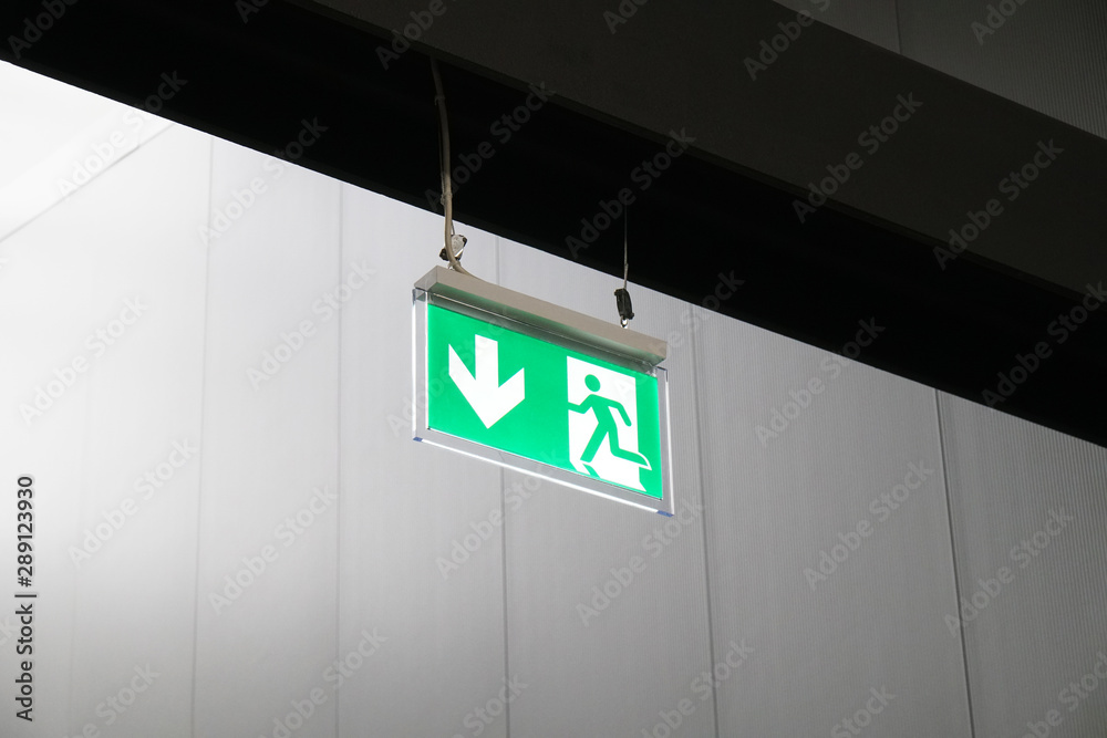 Stock-Foto „emergency exit or fire escape sign with green running man ...