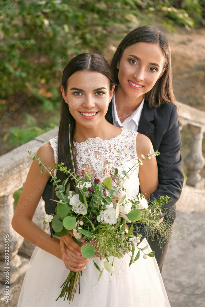 Beautiful lesbian couple on their wedding day outdoors Stock Photo ...