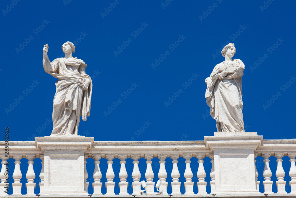 Detail of the statues of saints that crown the colonnades of St. Peter ...