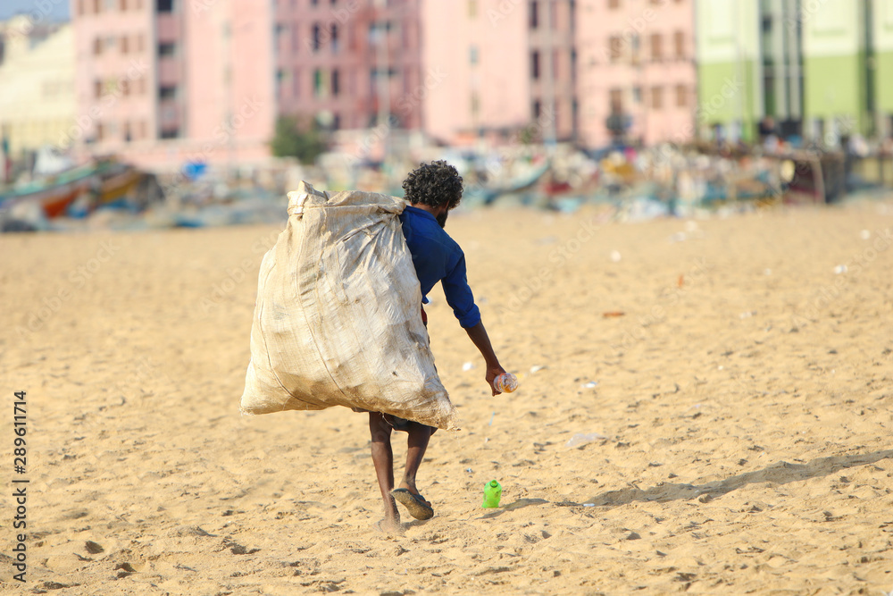 Plastic waste collector in beach Stock Photo | Adobe Stock