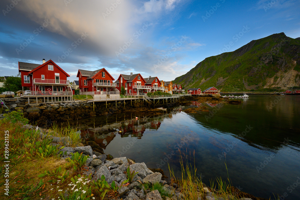 Beautiful waterfront house reflecting the water Evening and twilight ...