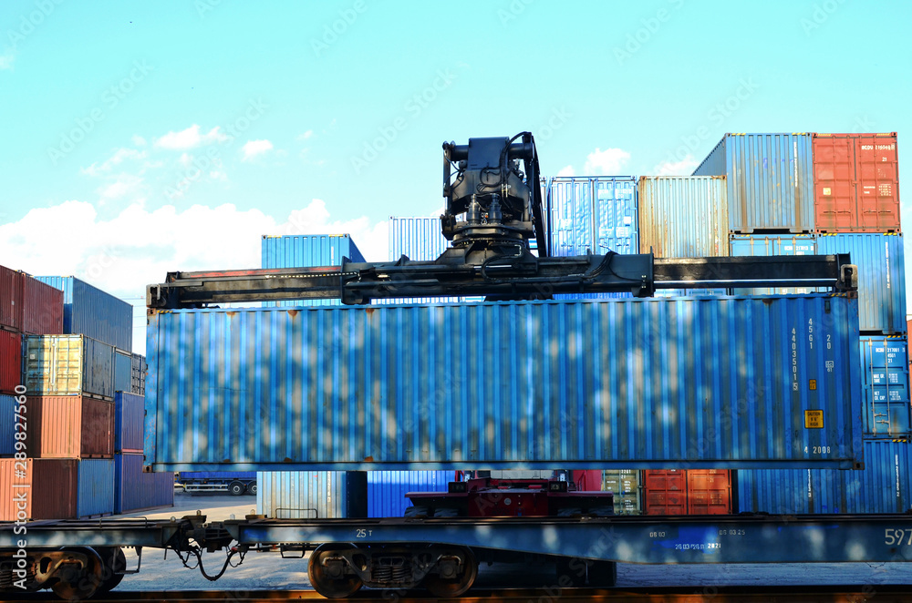 Shipping container loading by richtracker on the freight rail car at ...