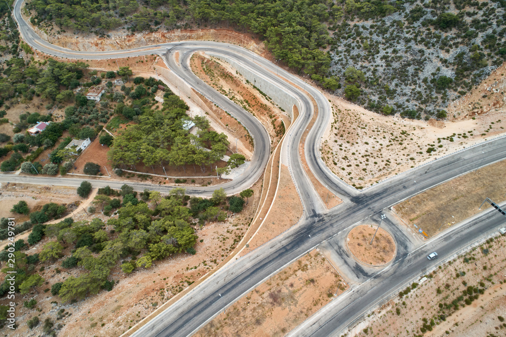 Highway interchange with roundabout, hairpin bends and retaining walls ...