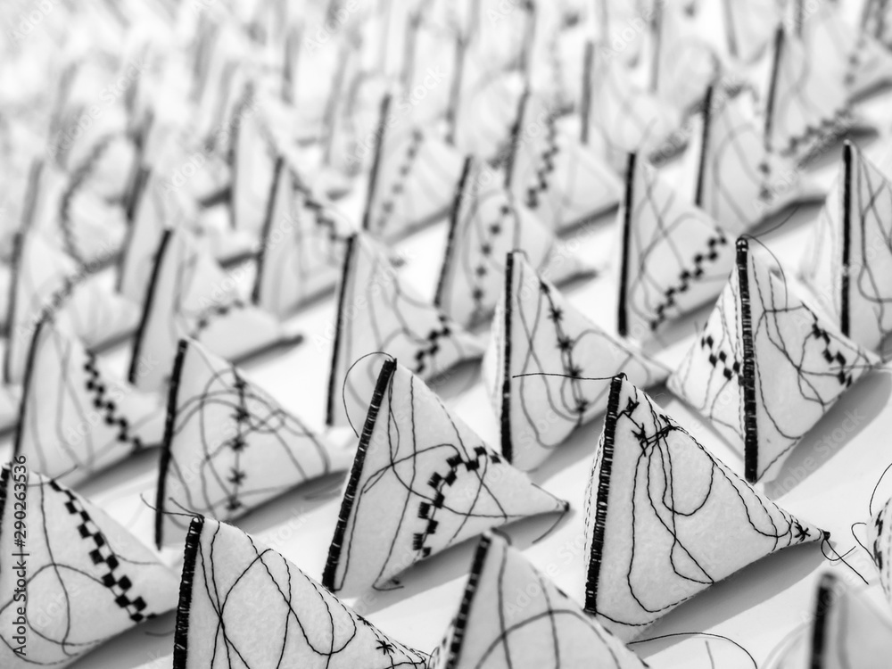 triangular small pyramids abstract black and white background with ...