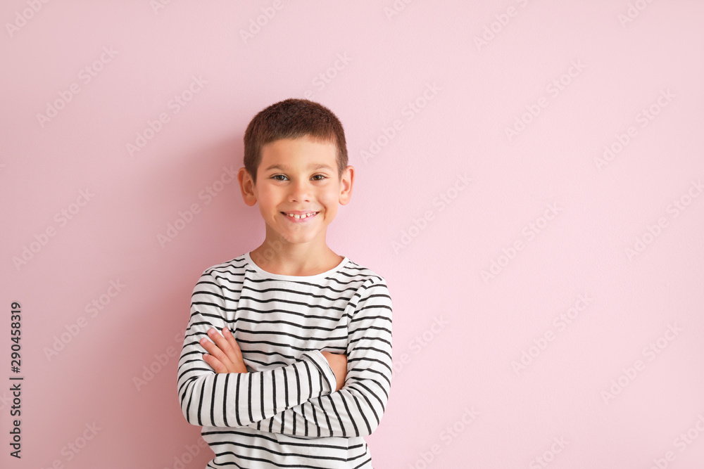 Portrait of happy little boy on color background Stock Photo | Adobe Stock