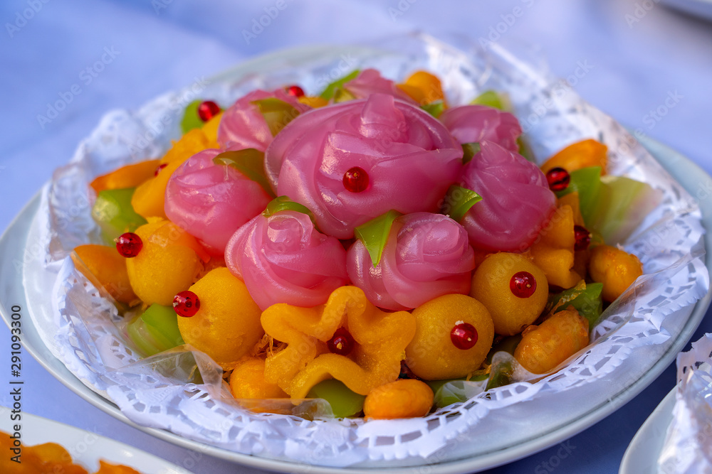 Thai sweet cake. Thai traditional dessert in pink rose flowers shaped ...