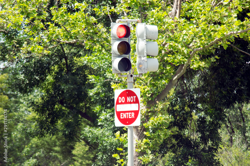 Do Not Enter sign attached to a traffic light pole prohibit entrance ...