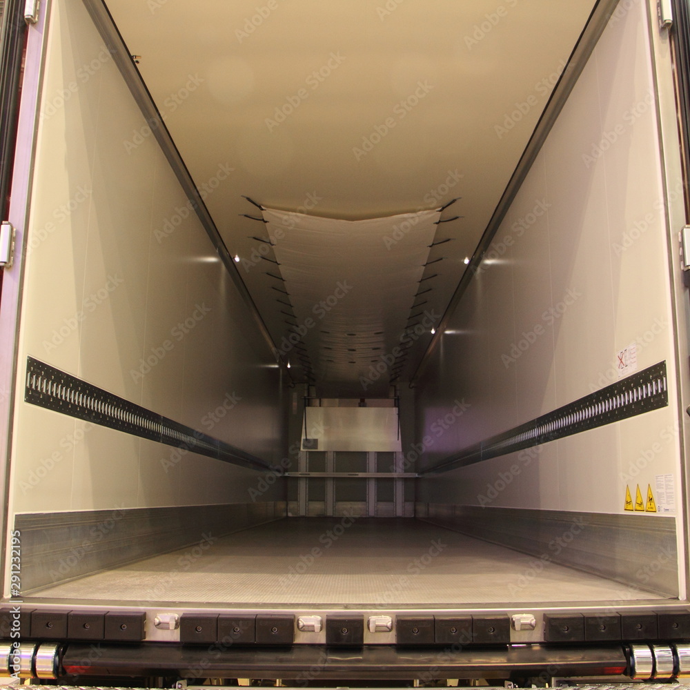 Foto de Stock New empty semi trailer inside view closeup, rear loading ...