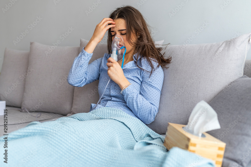 Nebulizer aerosol woman inhaler machine medicine at home. Portrait of a ...