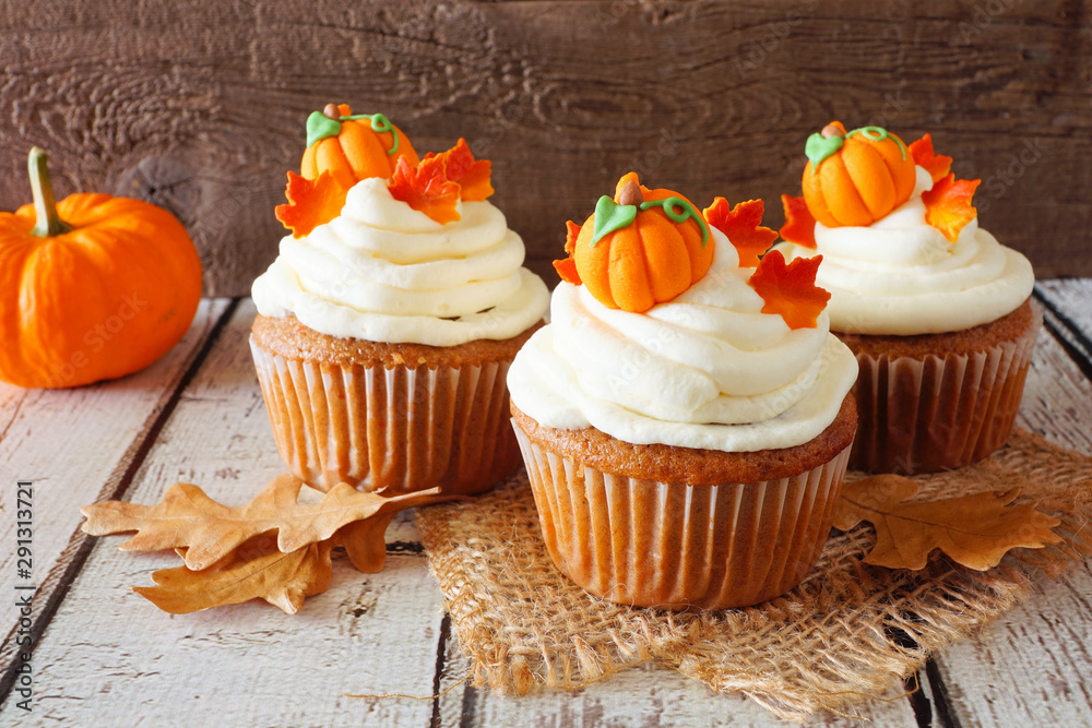 Fall pumpkin spice cupcakes with creamy frosting and autumn toppings ...