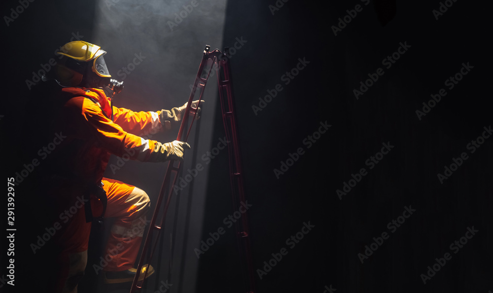Noise and grain defocus of firefighter man in safety fire suit and ...