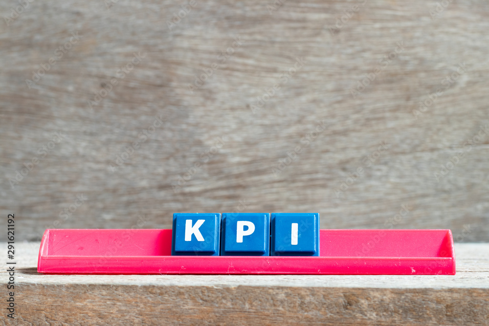Tile letter on red rack in word KPI (Abbreviation of key performance ...