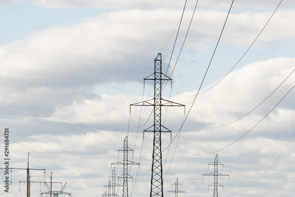 High-voltage technological power lines on metal poles with powerful ...