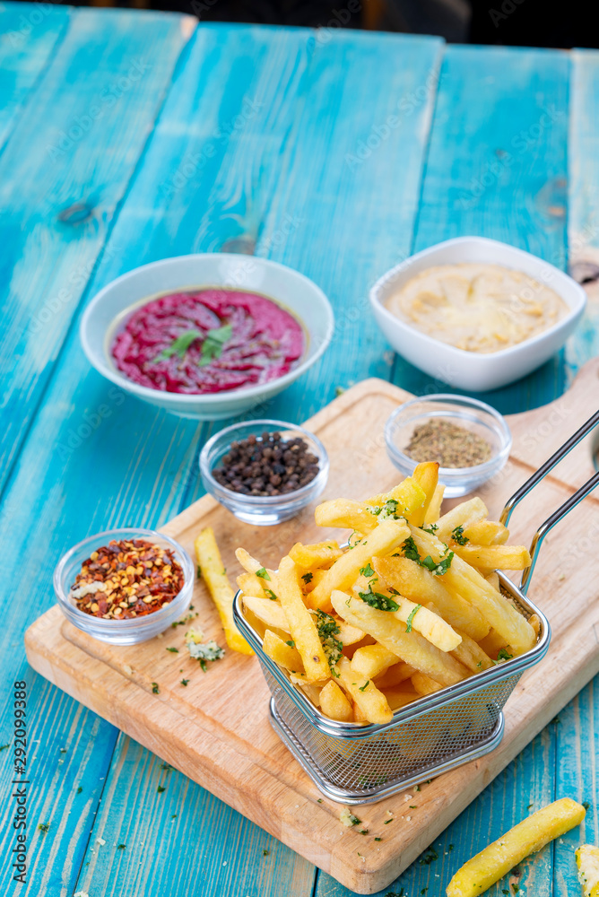 Fries Potato in Basket with Hommos and Red Hommos, Fried Potato with ...