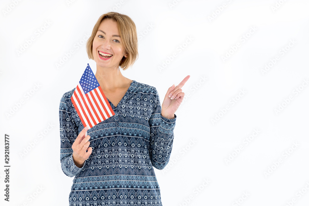 Beautiful woman with the flag of the United States of America points ...