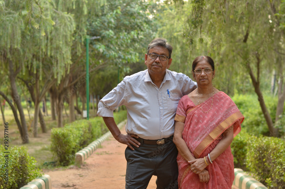 Happy looking retired senior Indian man and woman couple smiling and ...