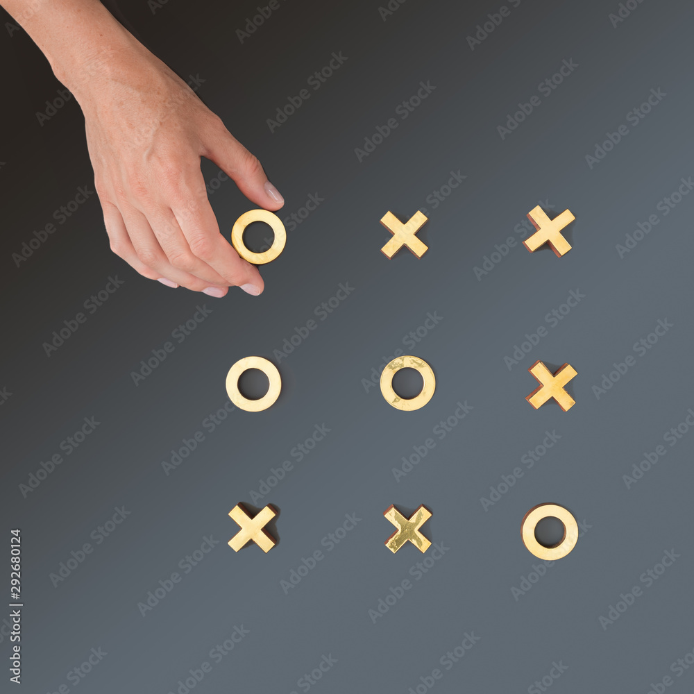 Tic Tac Toe game. Winning hand. X's and O's game. Nought crosses game ...