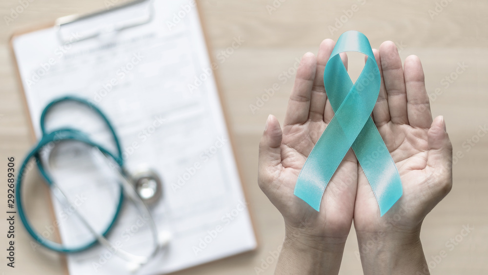 Teal ribbon awareness on woman's hand for Ovarian Cancer, Polycystic ...
