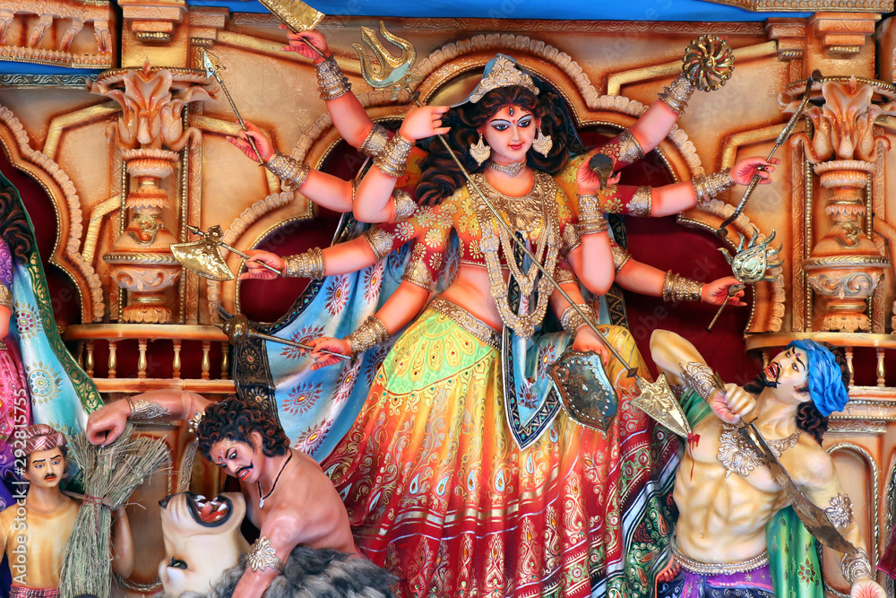 Goddess Durga idol at decorated Durga Puja pandal, shot at colored ...