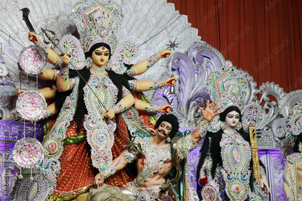 Goddess Durga idol at decorated Durga Puja pandal, shot at colored ...