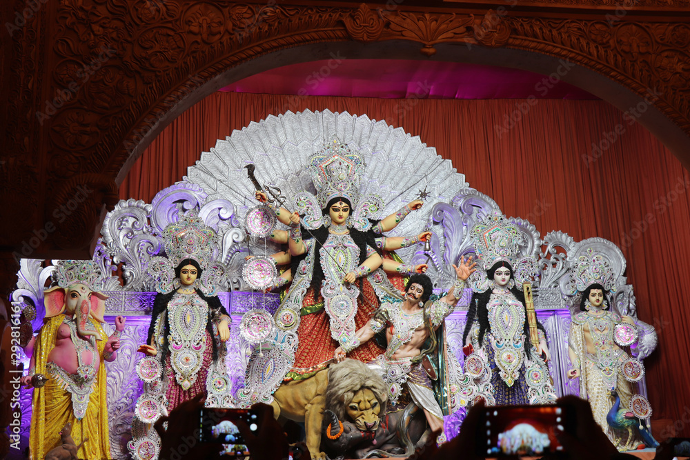Goddess Durga idol at decorated Durga Puja pandal, shot at colored ...