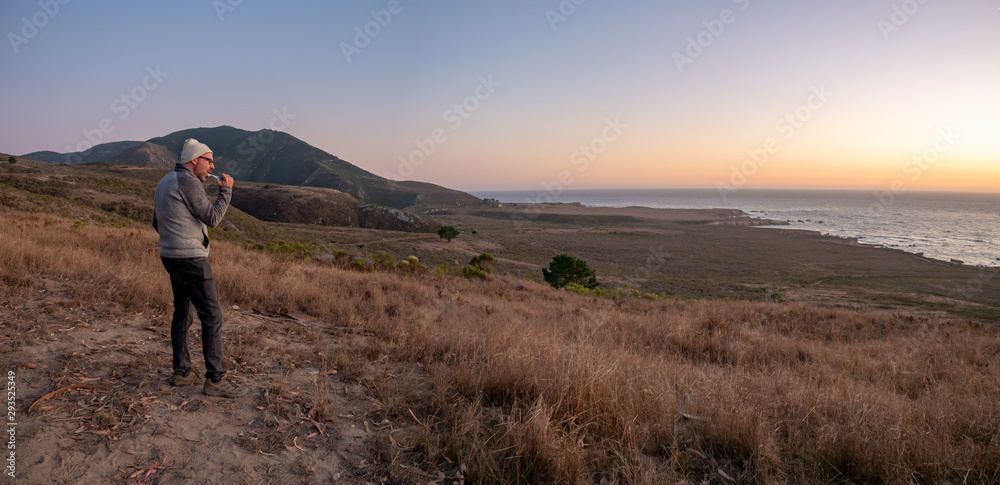Camper brushing teeth on bluff over ocean at Montana de Oro State Park ...