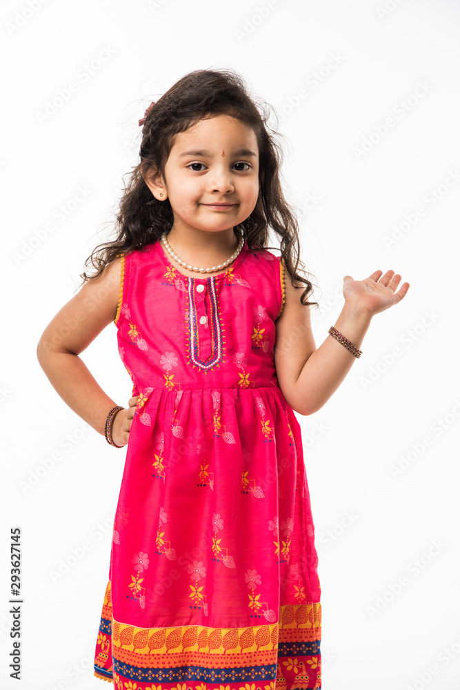 Portrait of cute little Indian girl model, standing isolated over white ...