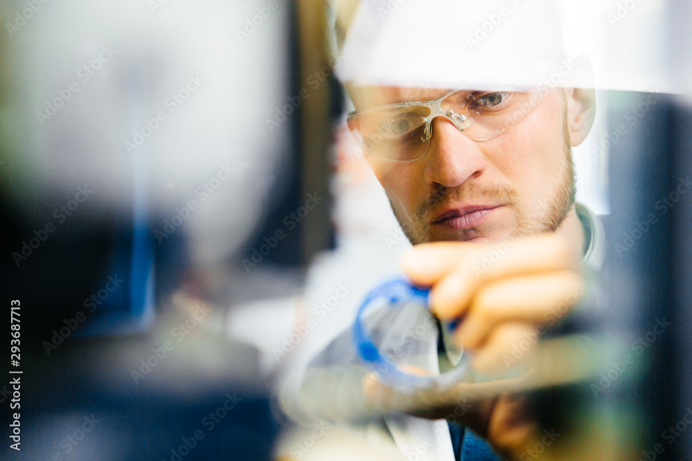 Scientist operates 3d printer Stock Photo | Adobe Stock