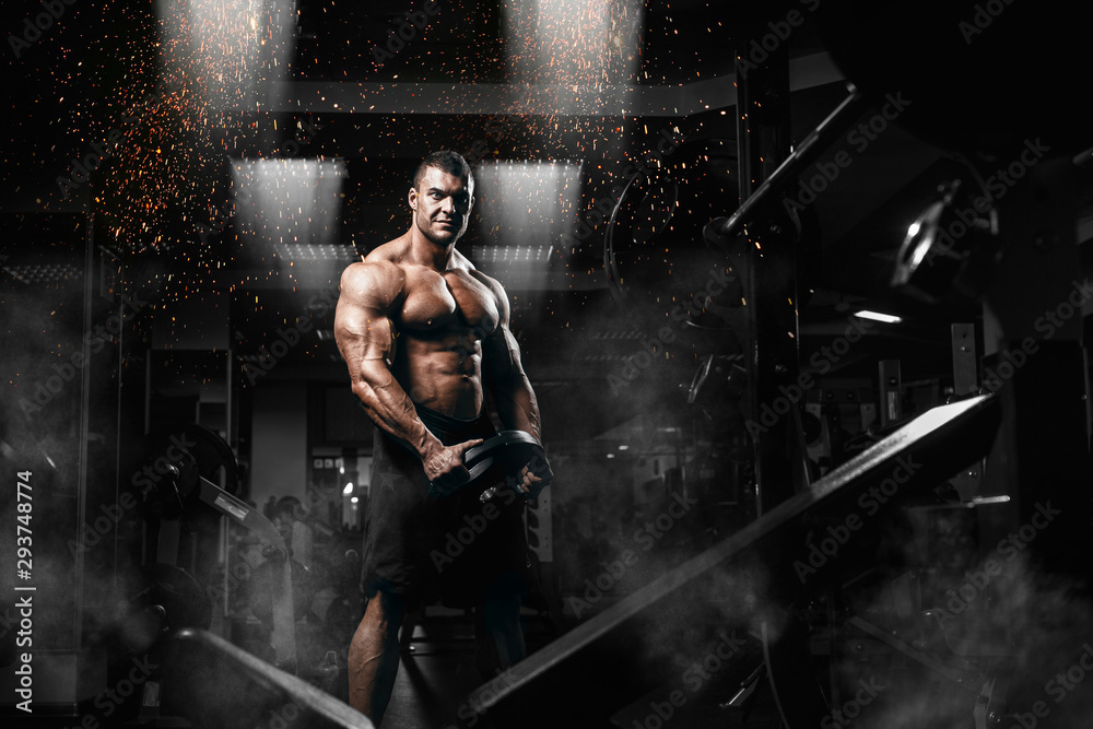 Muscular man bodybuilder training in gym and posing. Fit muscle guy ...